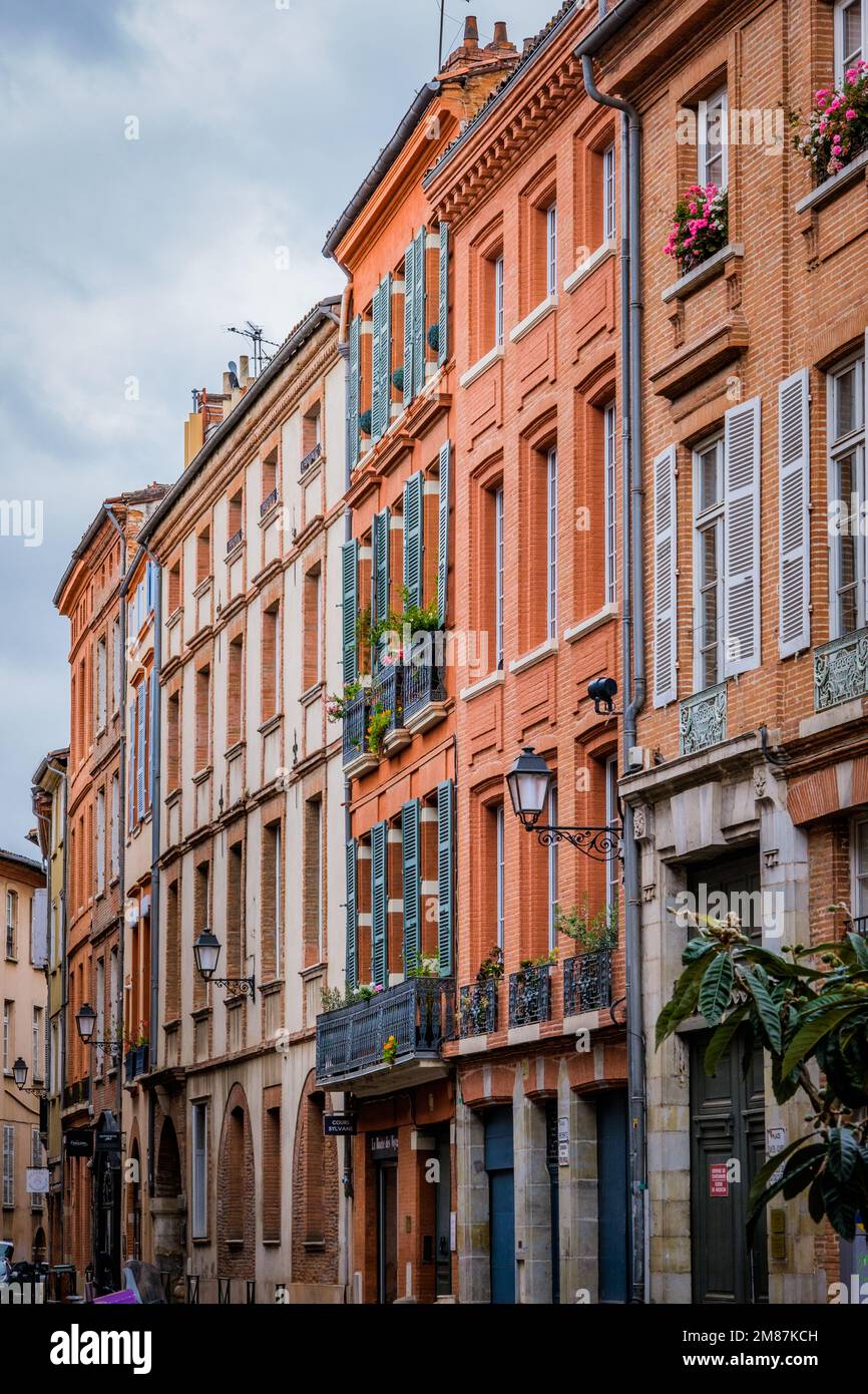 Beautiful facades with bricks in Perchepinte street in Toulouse old ...