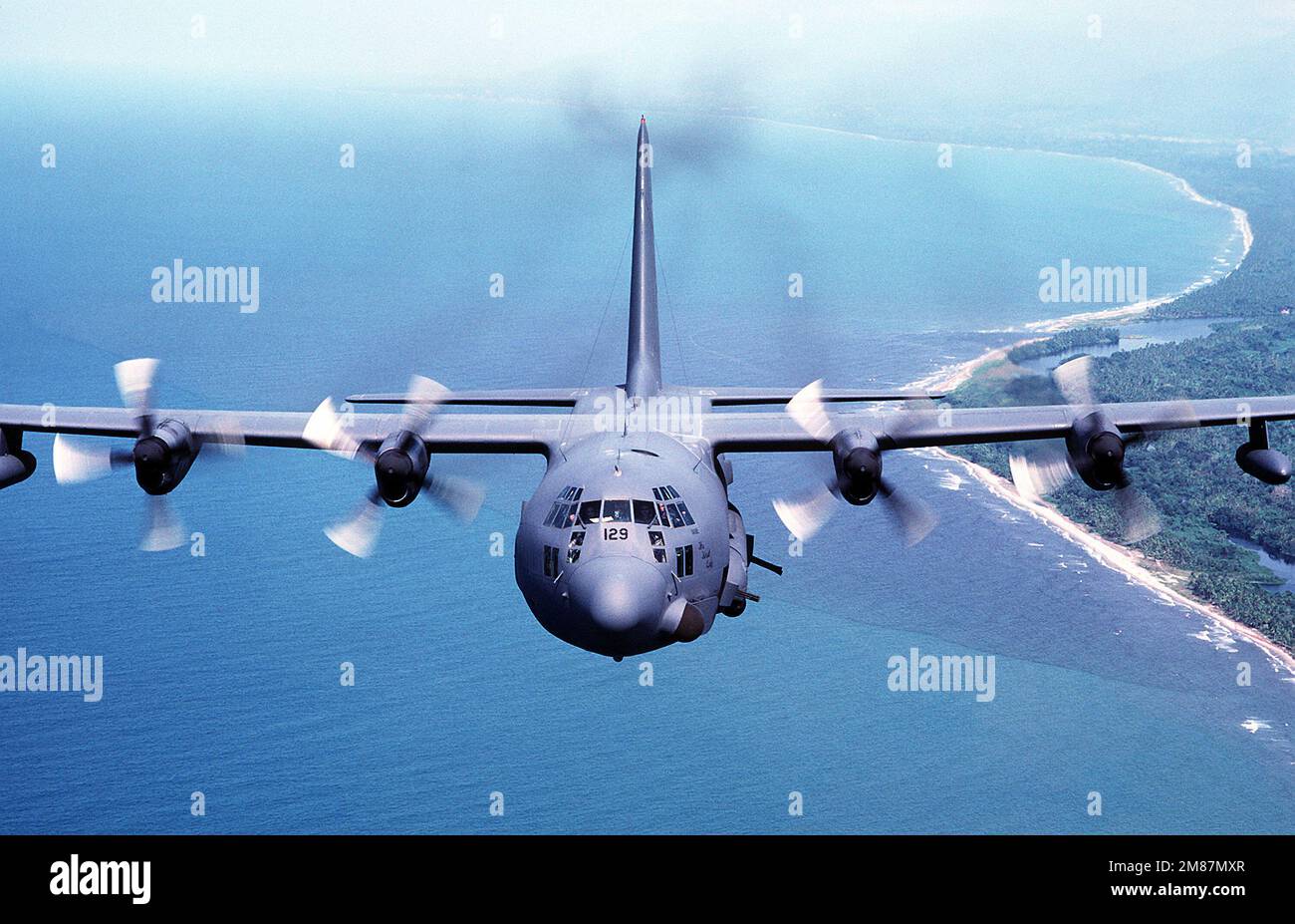 An air-to-air front view of a 919th Special Operations Group AC-130 ...
