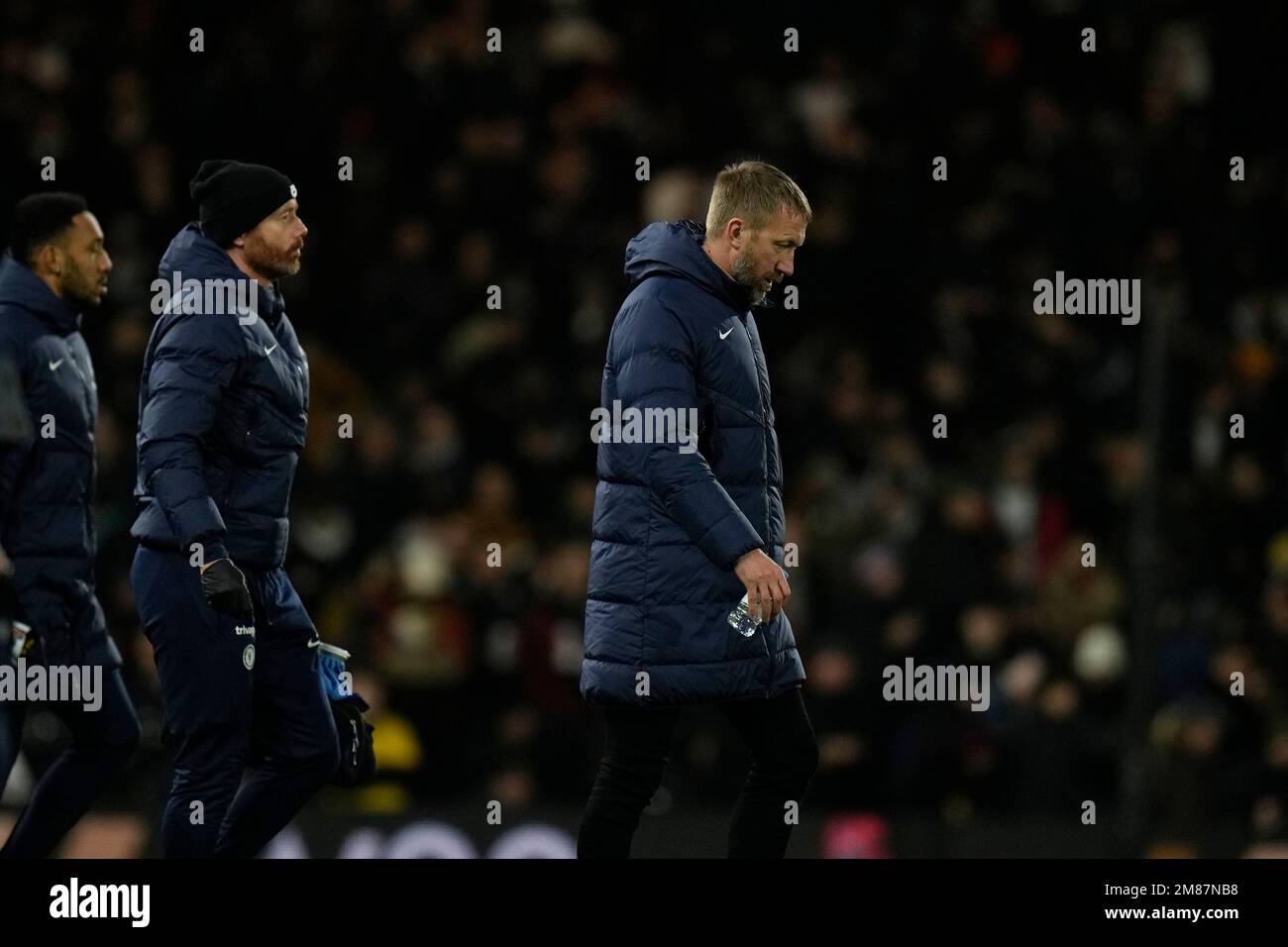 Chelsea's head coach Graham Potter, right, walks on the pitch after ...