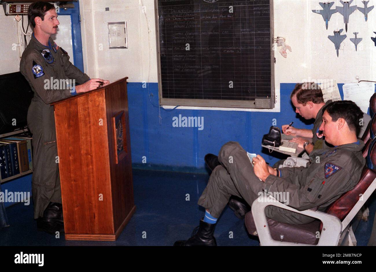 Flight crews attend a preflight briefing in the Fighter Squadron 143 ...
