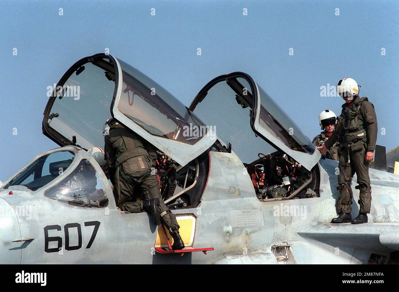 Members of an EA-6B Prowler flight crew make a final preflight check ...
