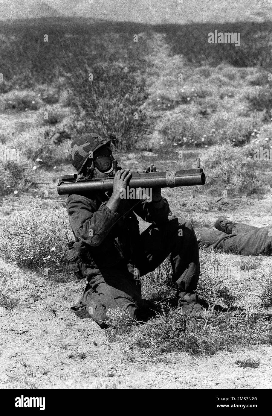 Wearing an M-17A1 field protective mask and a nuclear-biological ...