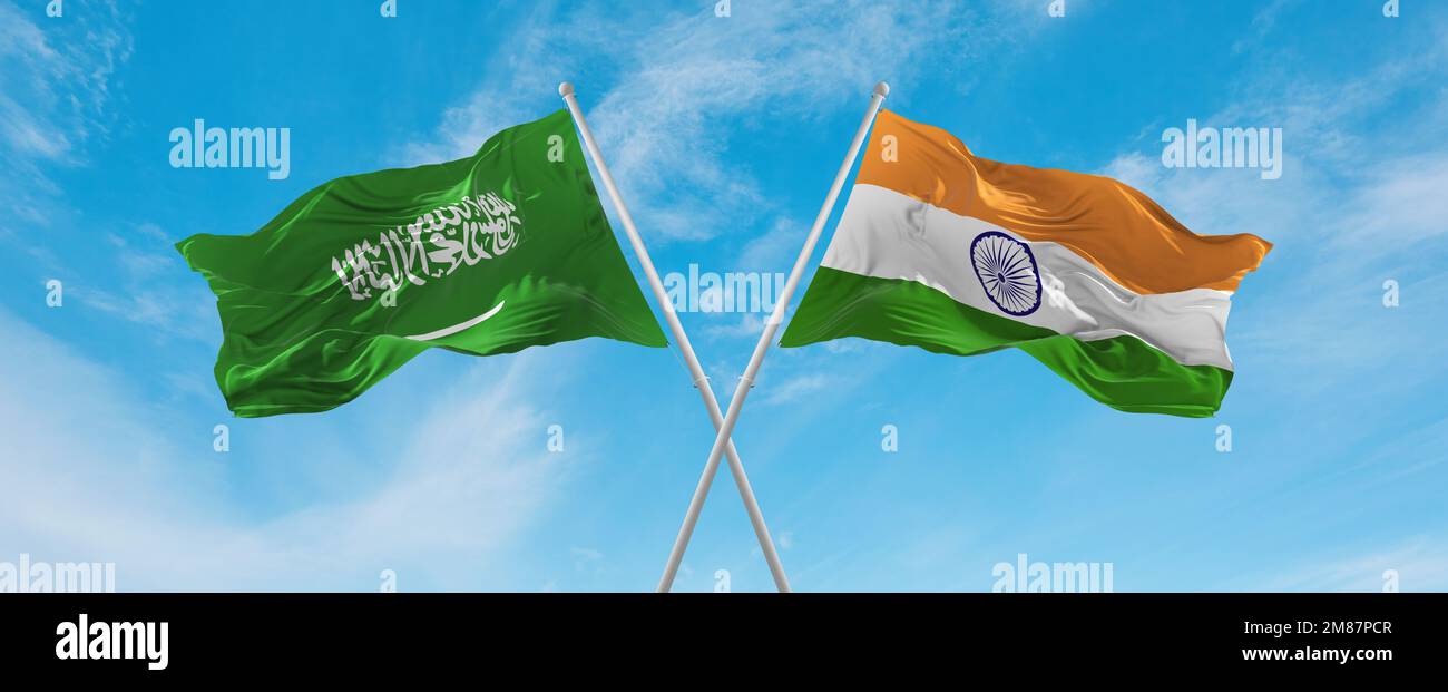 two crossed flags India and Saudi Arabia waving in wind at cloudy sky ...