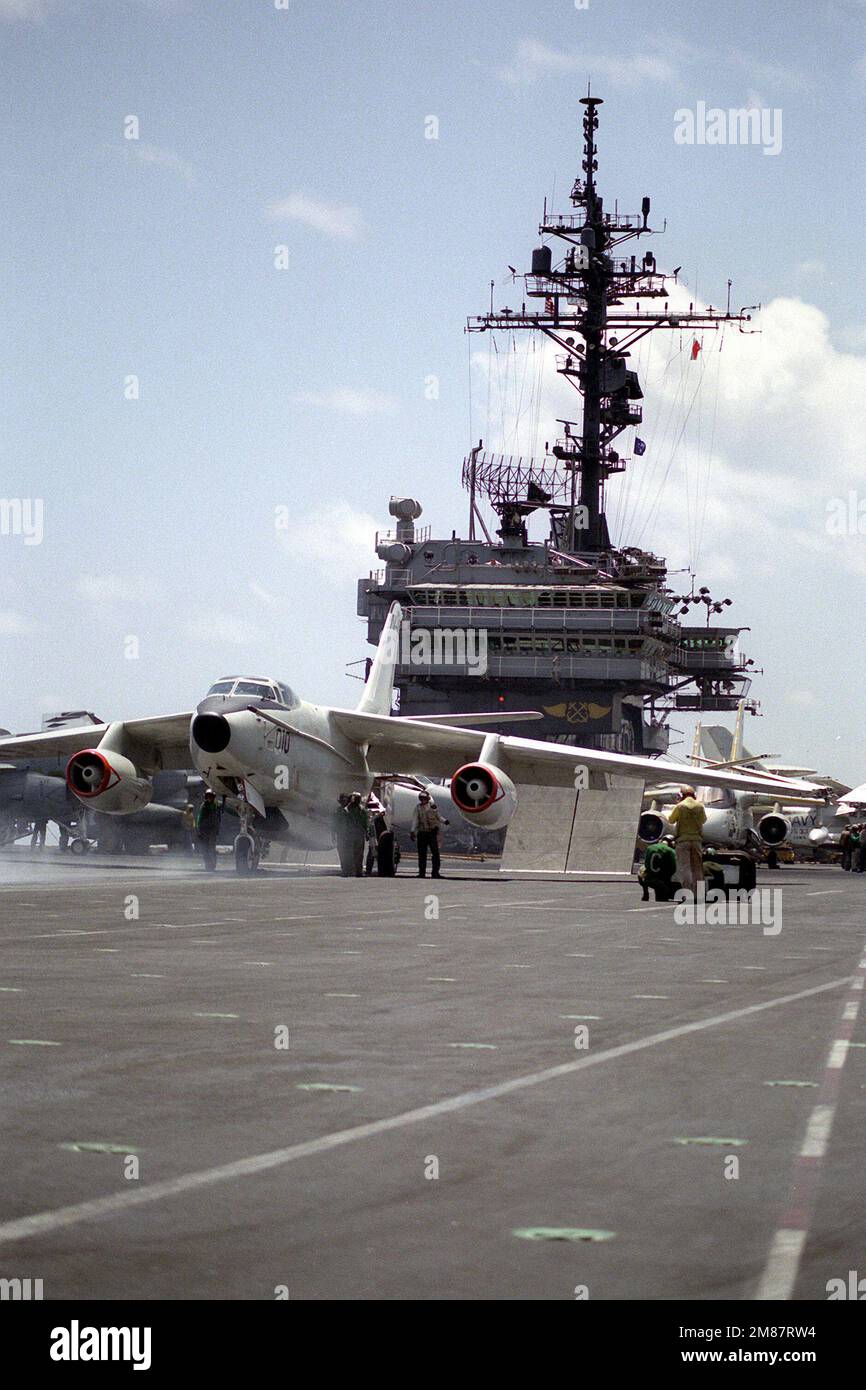 Catapult crewmen position a Fleet Air Reconnaissance Squadron (VQ-1) EA ...