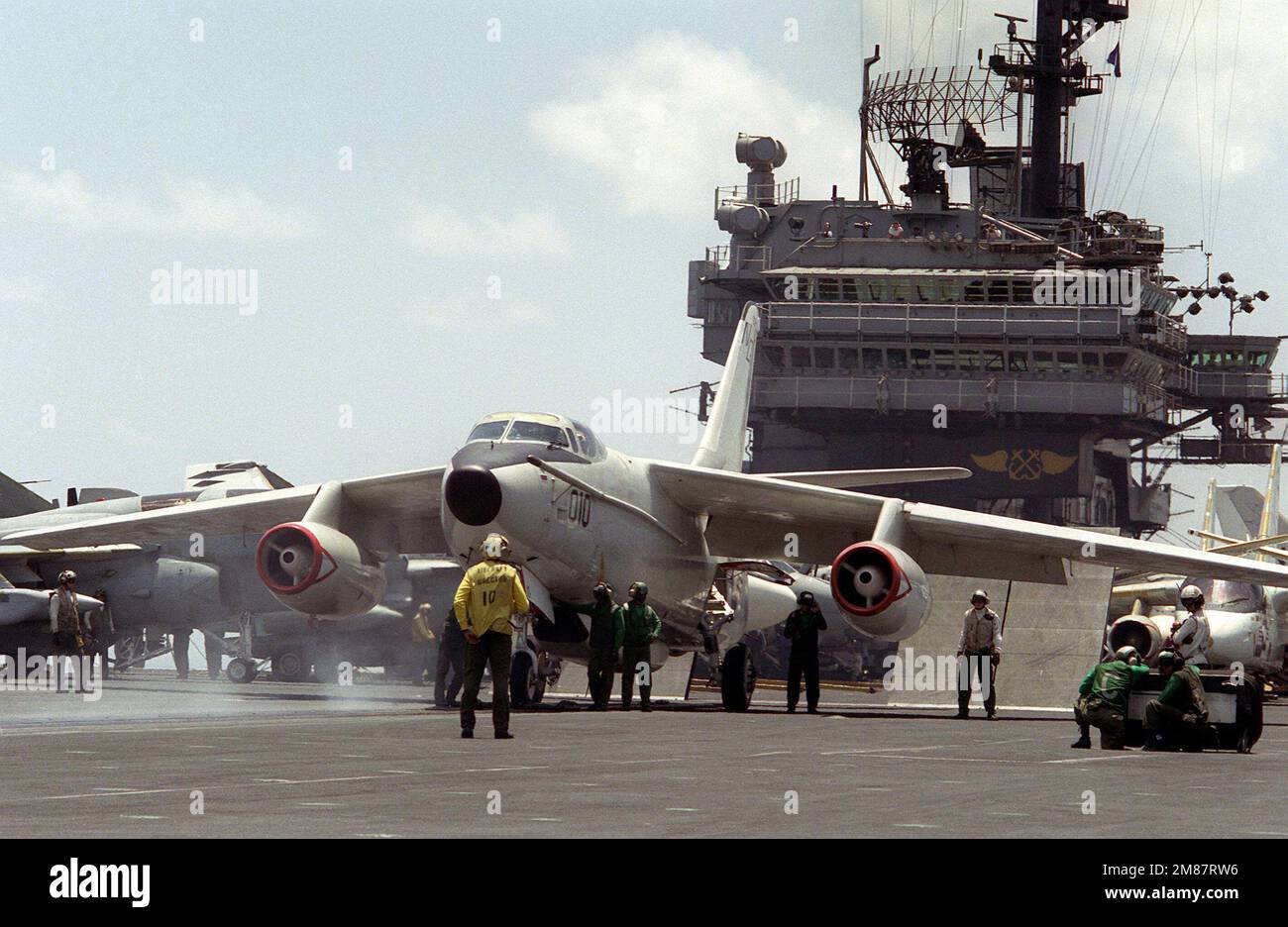 Catapult crewmen position a Fleet Air Reconnaissance Squadron (VQ-1) EA ...