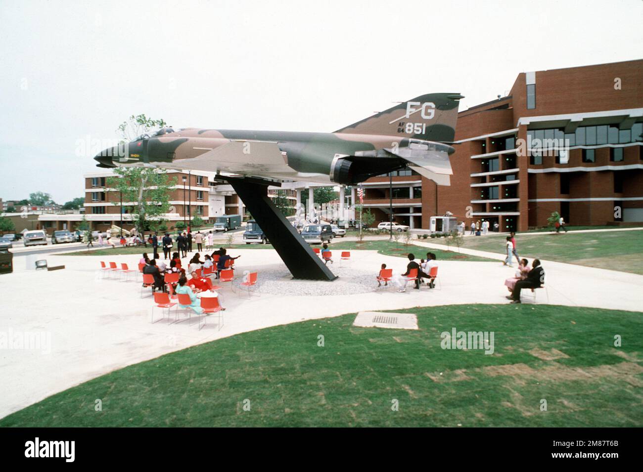 An F-4C PLhantom II aircraft stands in front of the GEN. Daniel ...