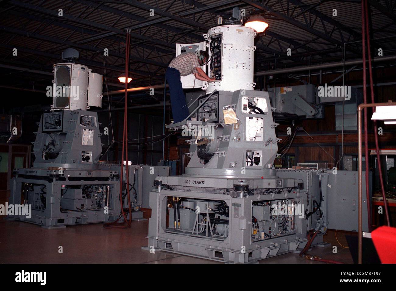 A technician checks over the radar transmitter and microwave assemblies ...