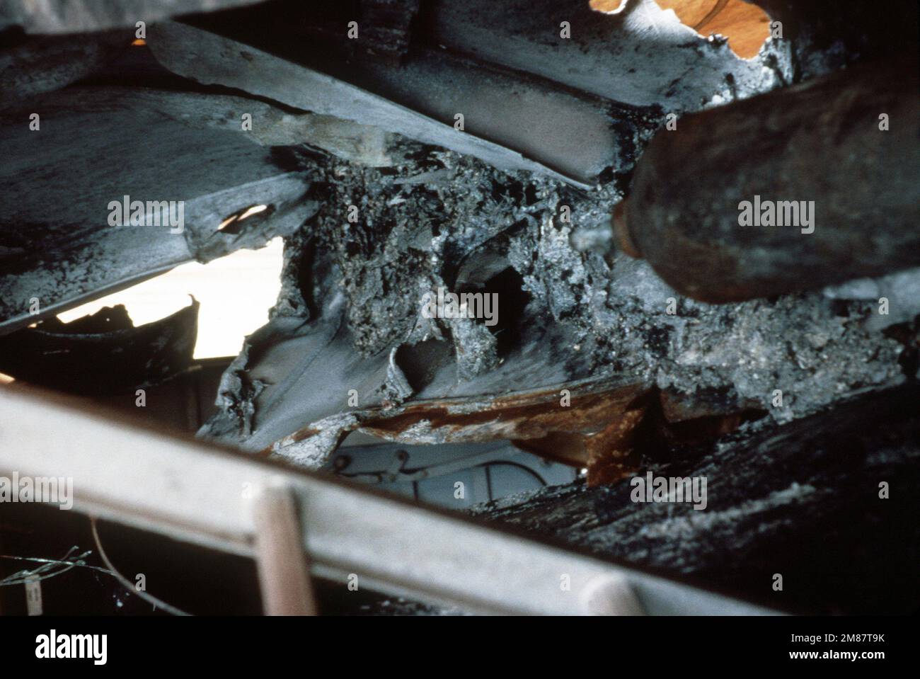 A view of damage sustained by the guided missile frigate USS STARK (FFG ...