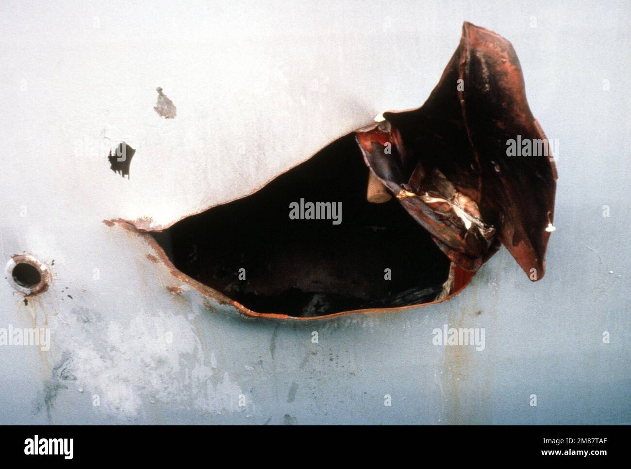 A view of damage sustained by the guided missile frigate USS STARK (FFG ...