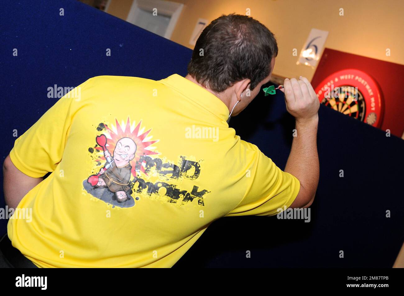 Professional dart player arron monk throwing dart uk Stock Photo - Alamy