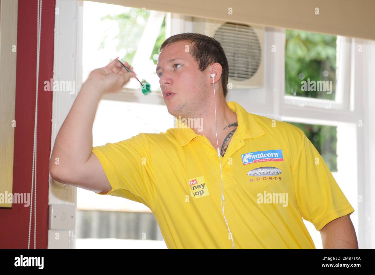 Professional dart player arron monk throwing dart uk Stock Photo - Alamy