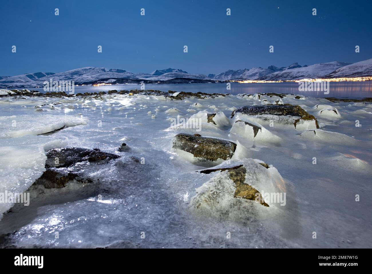 Frozen salt water under full moon, night in the Arctic in freezing ...