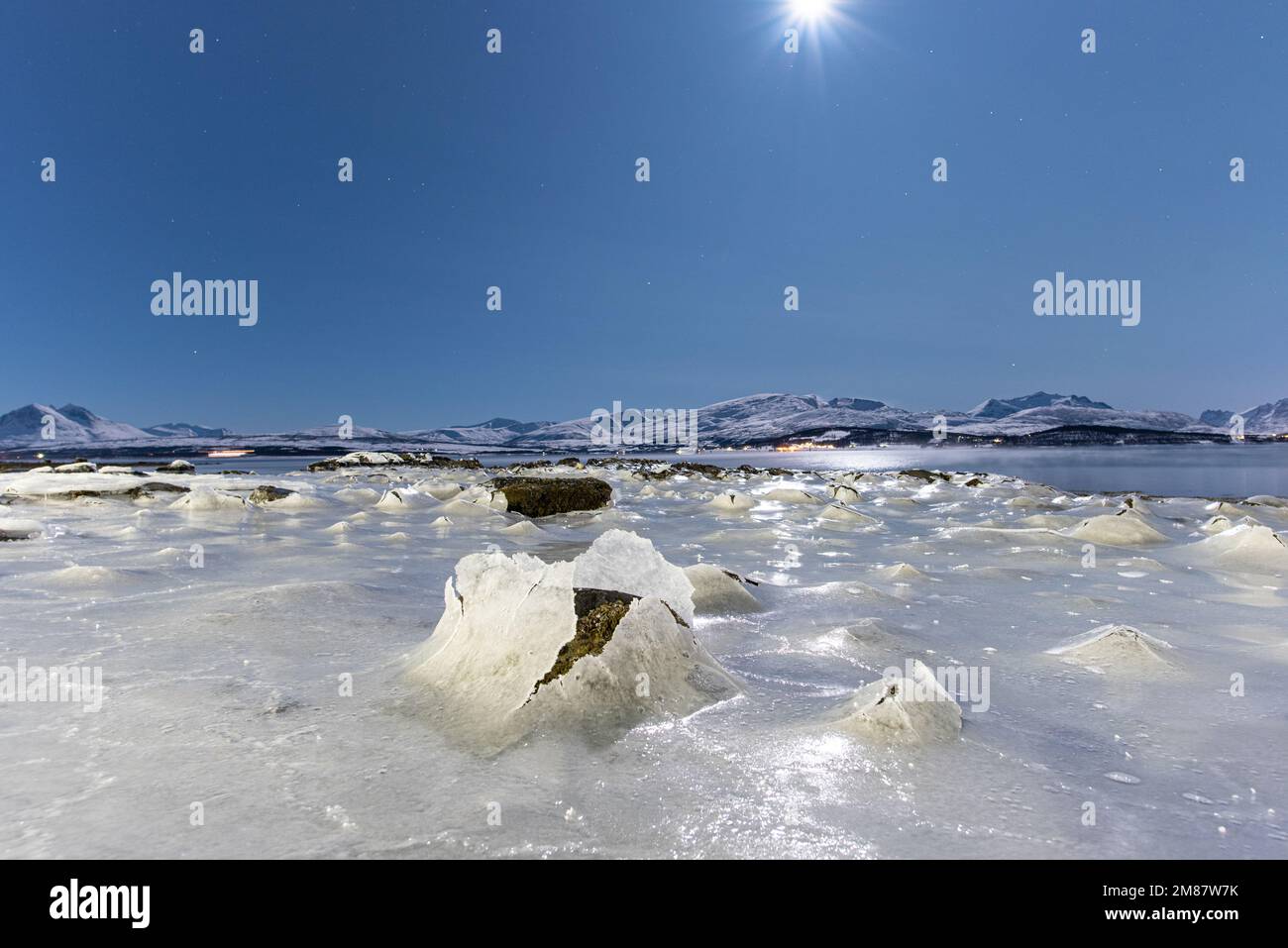 Frozen salt water under full moon, night in the Arctic in freezing ...