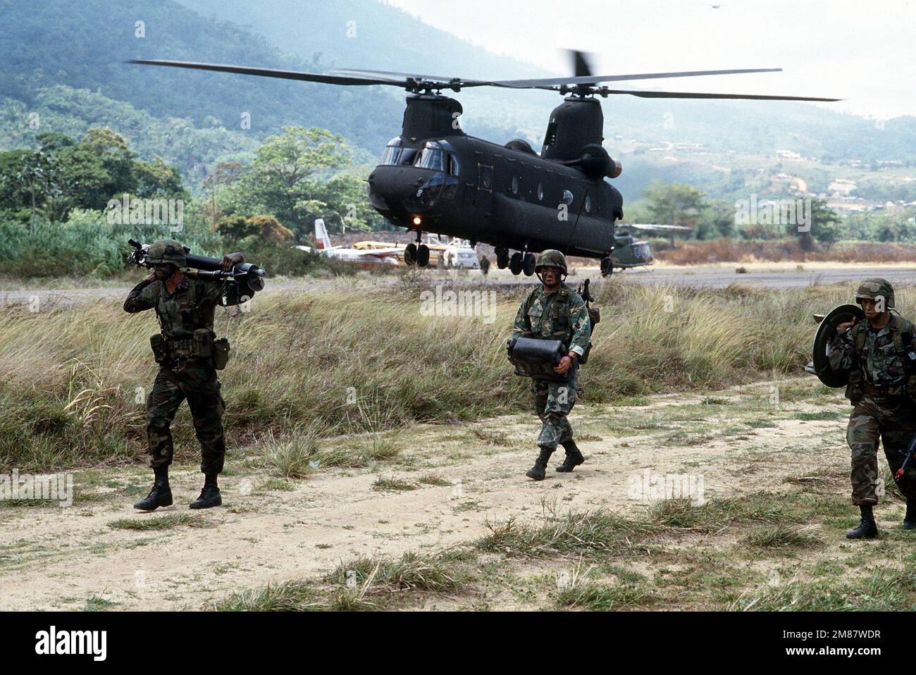 A U.S. Army CH-47 Chinook helicopter takes off after inserting troops ...