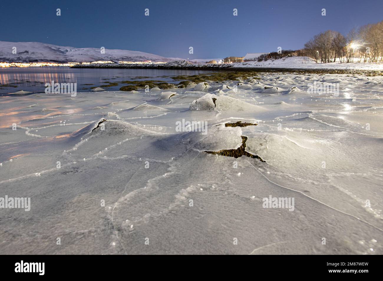 Frozen salt water under full moon, night in the Arctic in freezing ...