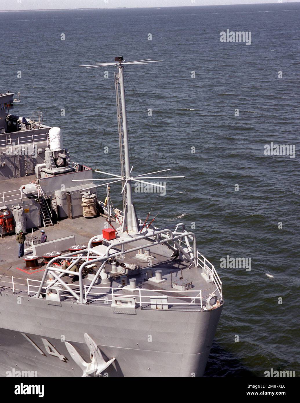 The dipole antenna mounted on the bow of the amphibious transport USS ...