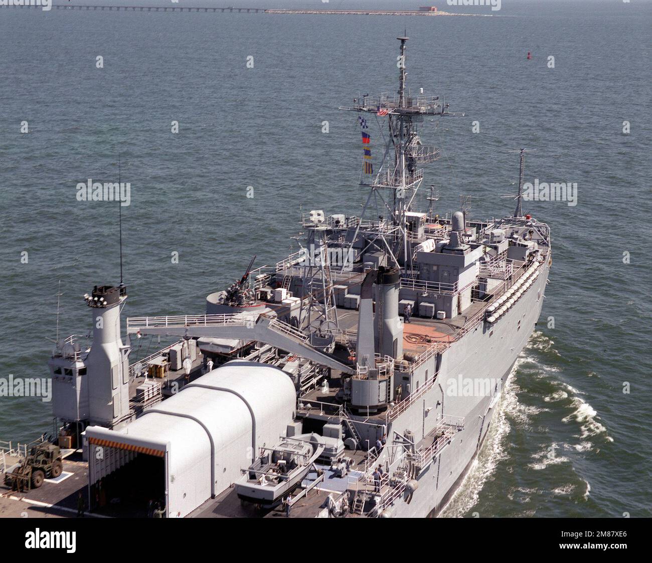 A starboard quarter view of the hangar bay and superstructure of the ...