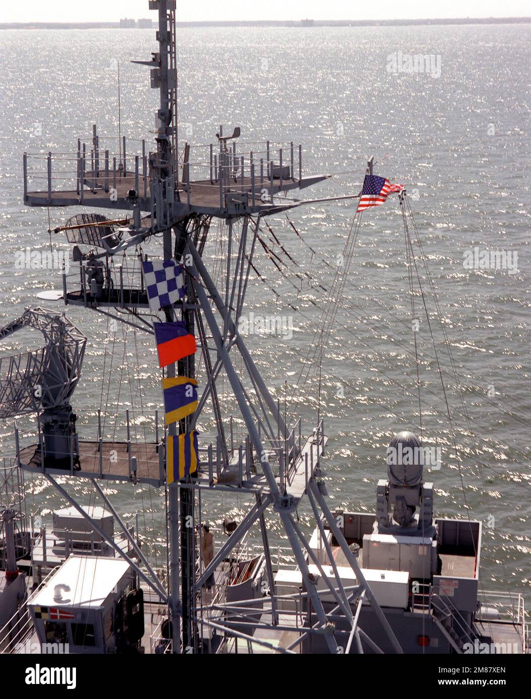 An amidships view of the antenna rigging on the mast of the amphibious ...