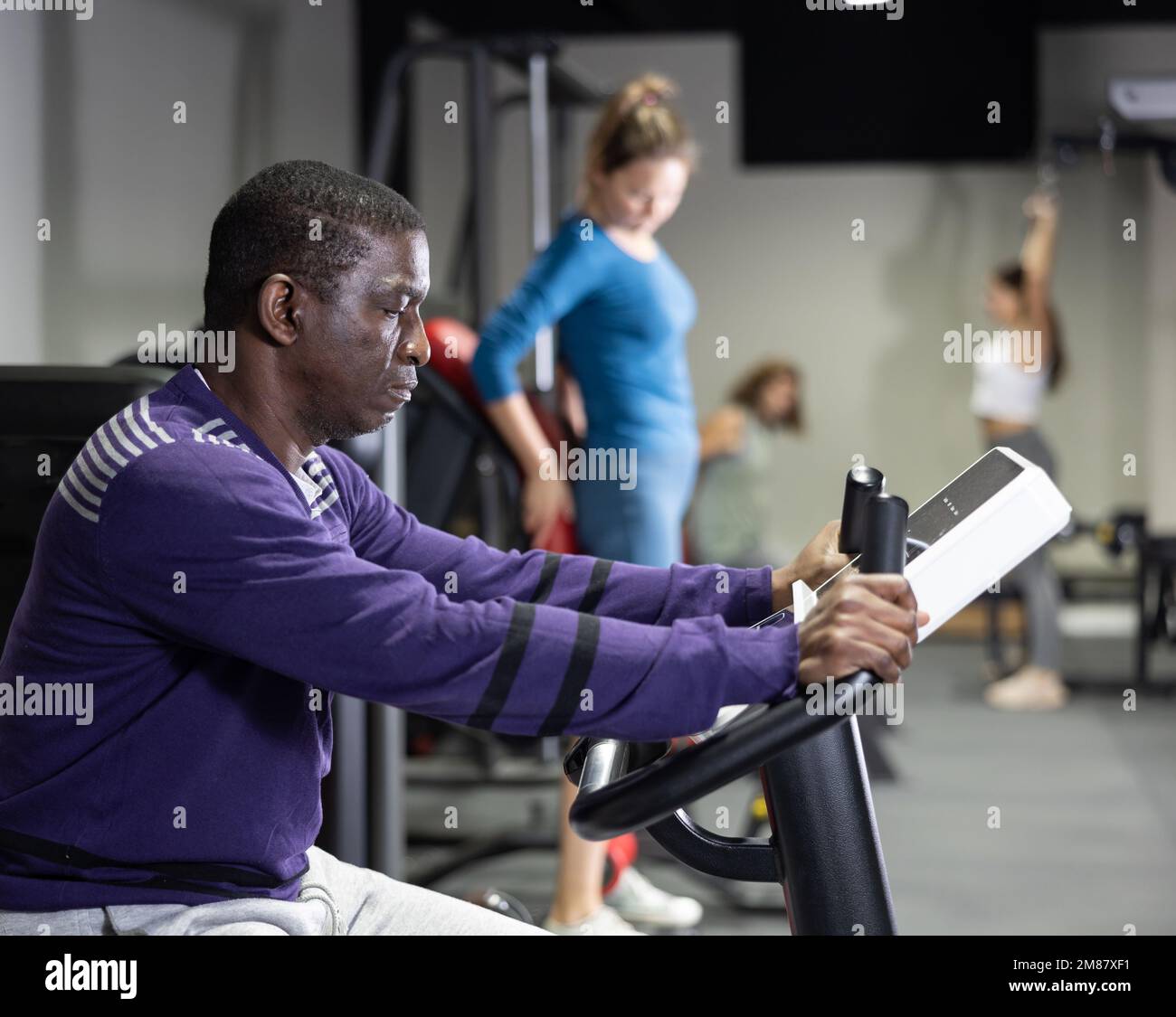 Adult man using bicycle exercise hi-res stock photography and images ...