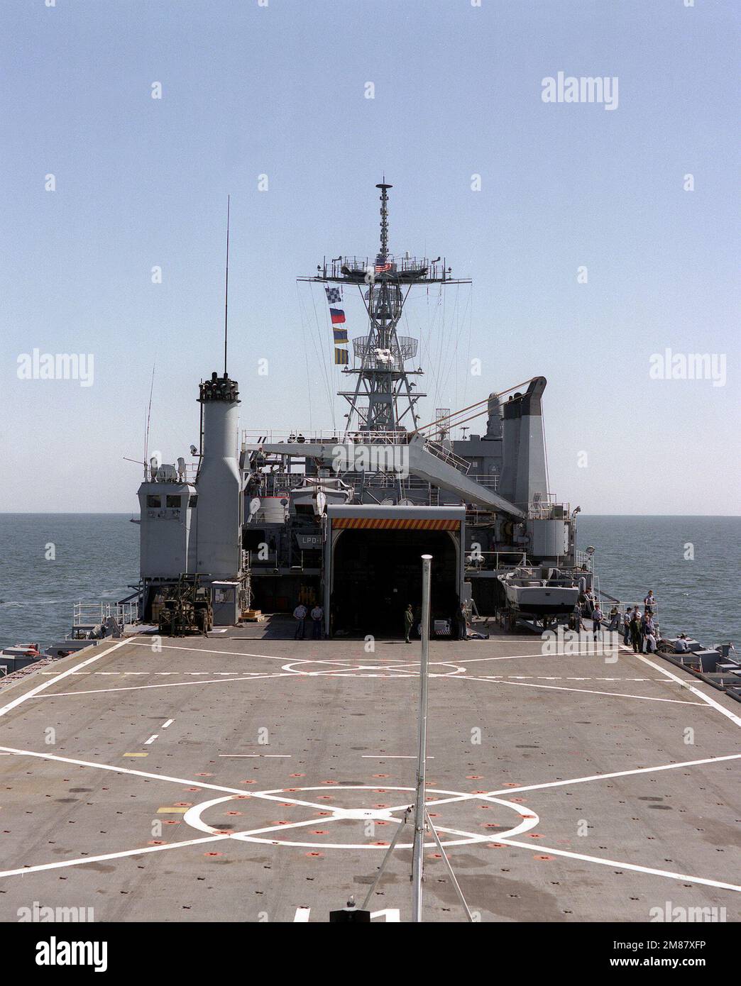 A view of the helicopter deck, hangar bay and superstructure of the ...