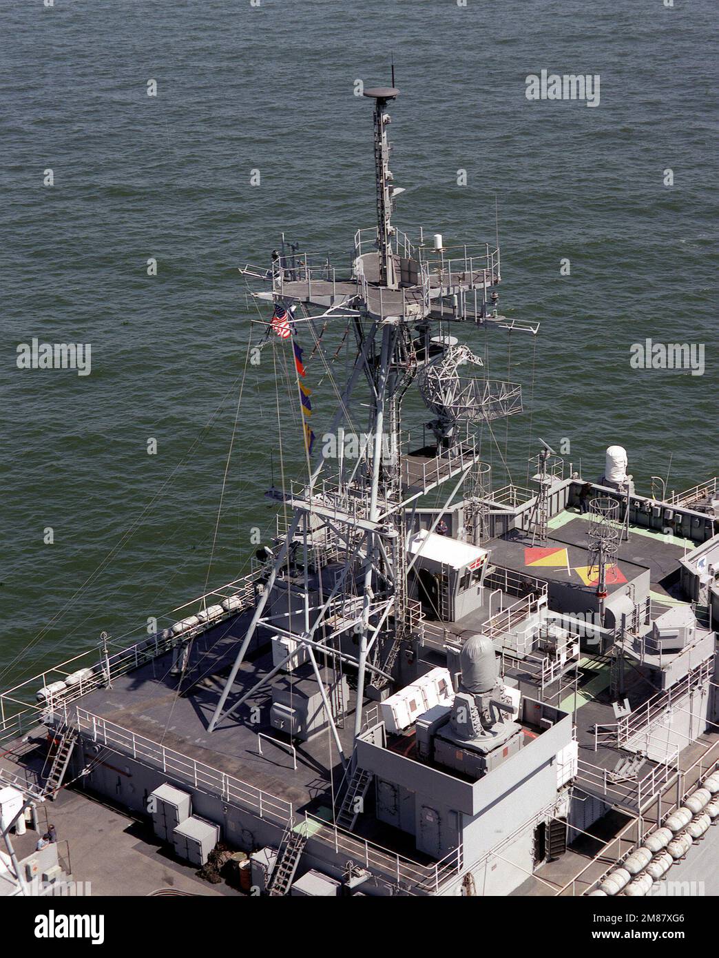 An amidships view of the antenna rigging on the mast of the amphibious ...