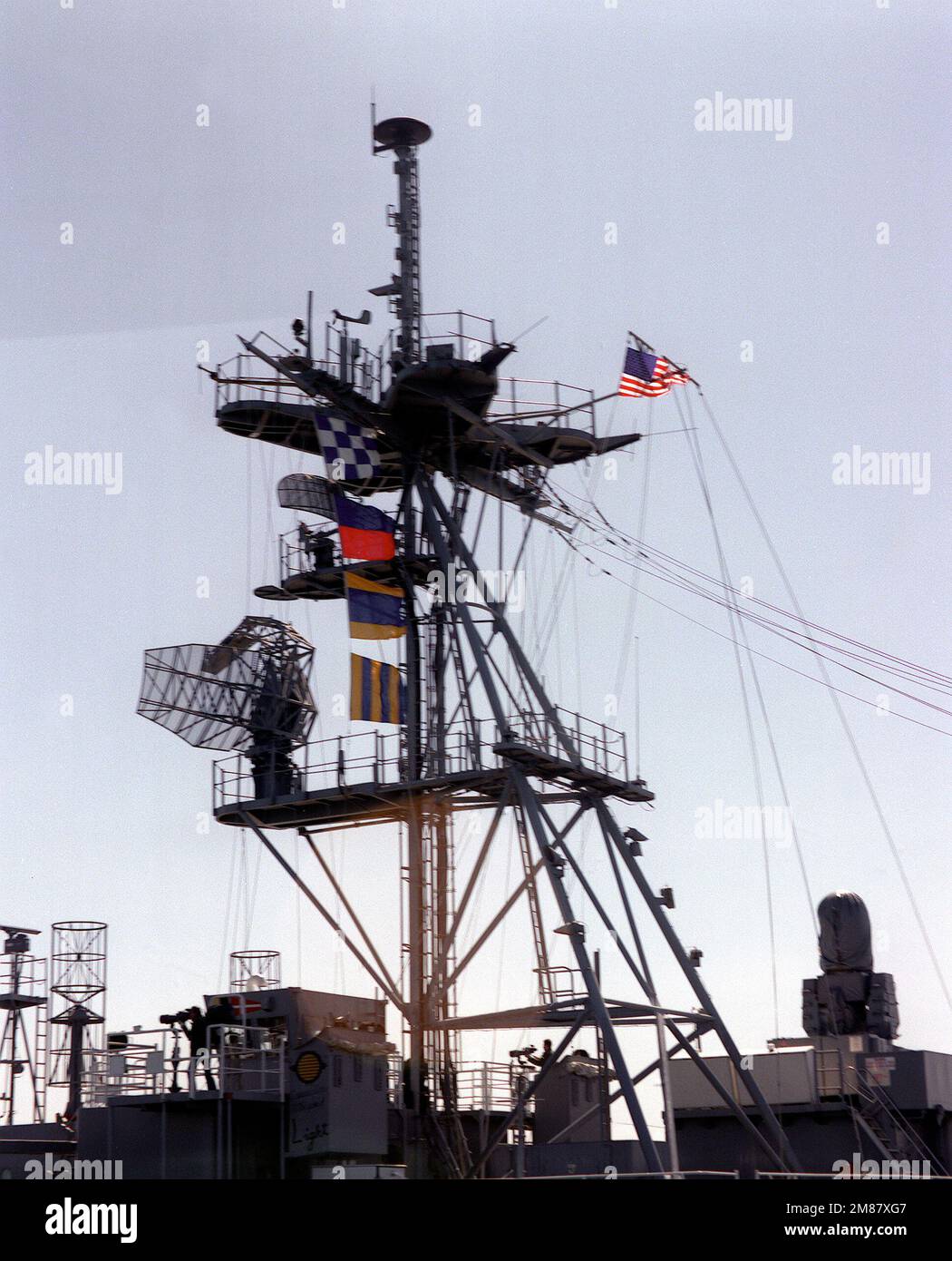 An amidships view of the antenna rigging on the mast of the amphibious ...