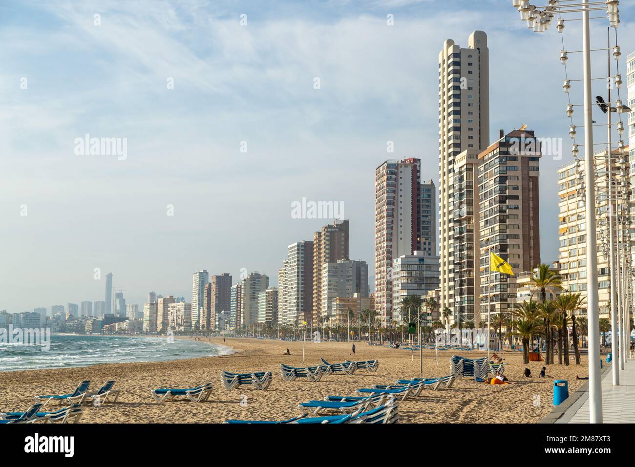 The beach in Benidorm with Skyscrapers on a sunny December morning ...