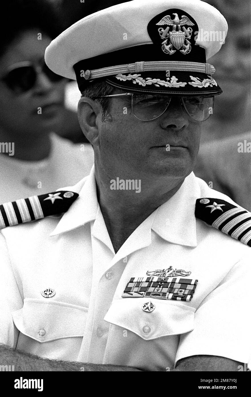 A U.S. naval officer attends the commissioning of the guided missile ...