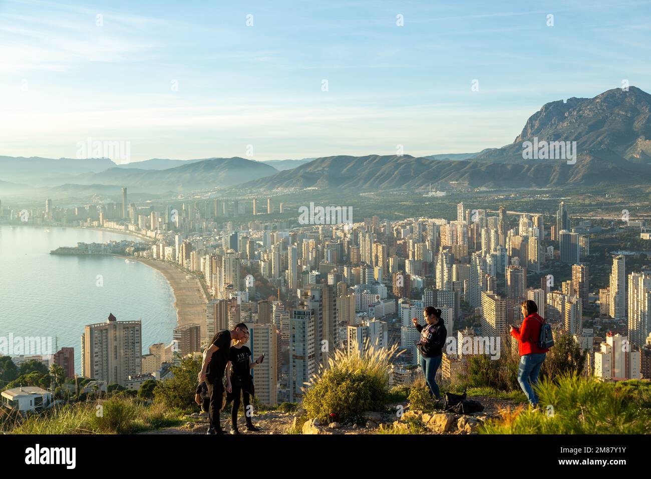 The city of Benidorm at sunset seen from Benidorm Cross with Puig ...
