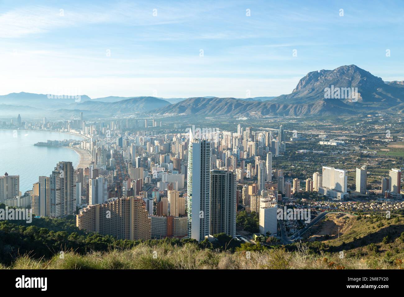 The city of Benidorm at sunset seen from Benidorm Cross with Puig ...