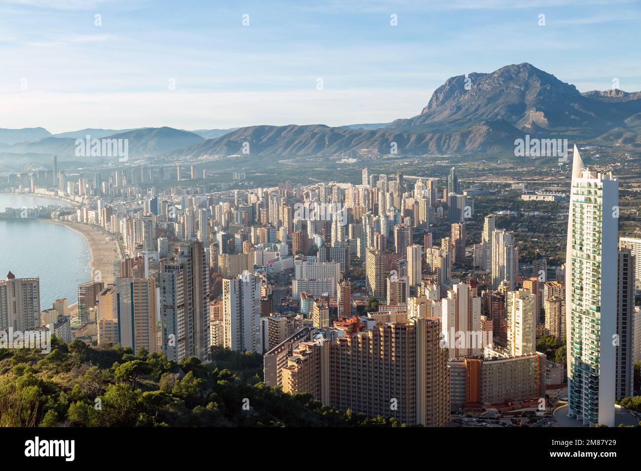 The city of Benidorm at sunset seen from Benidorm Cross with Puig ...