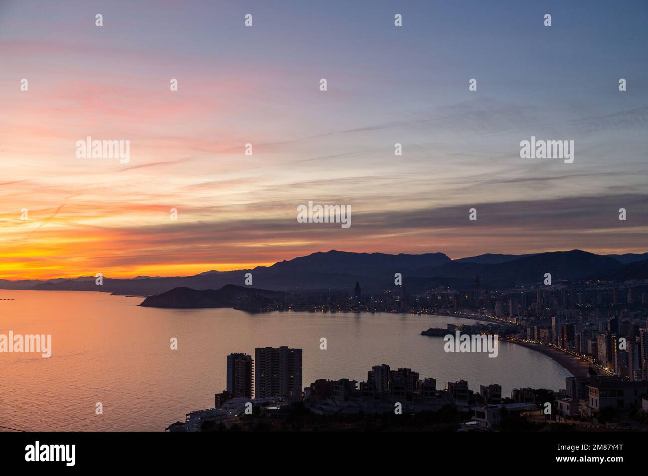 The city of Benidorm at sunset seen from Benidorm Cross Stock Photo - Alamy