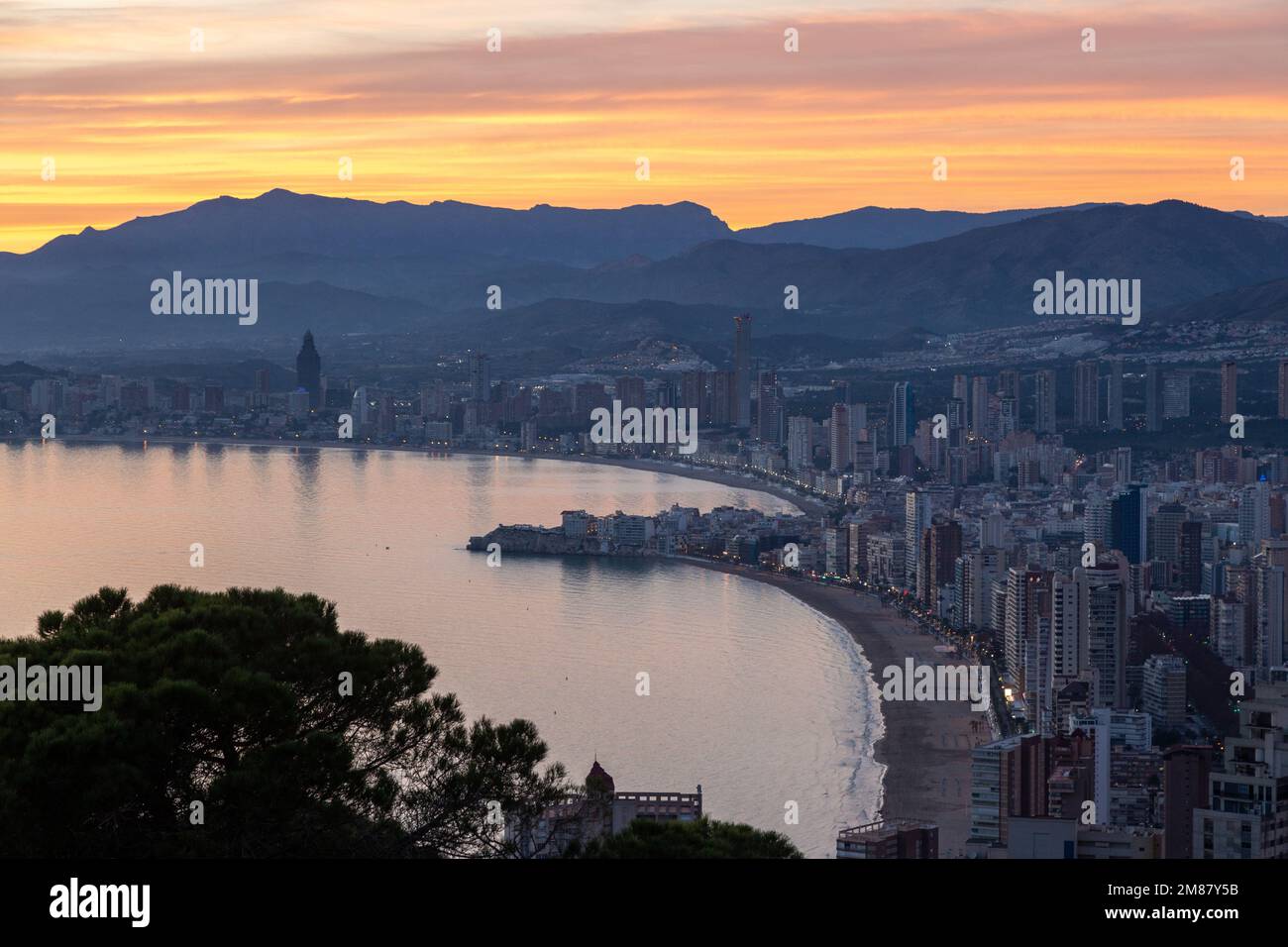 The city of Benidorm at sunset seen from Benidorm Cross Stock Photo - Alamy