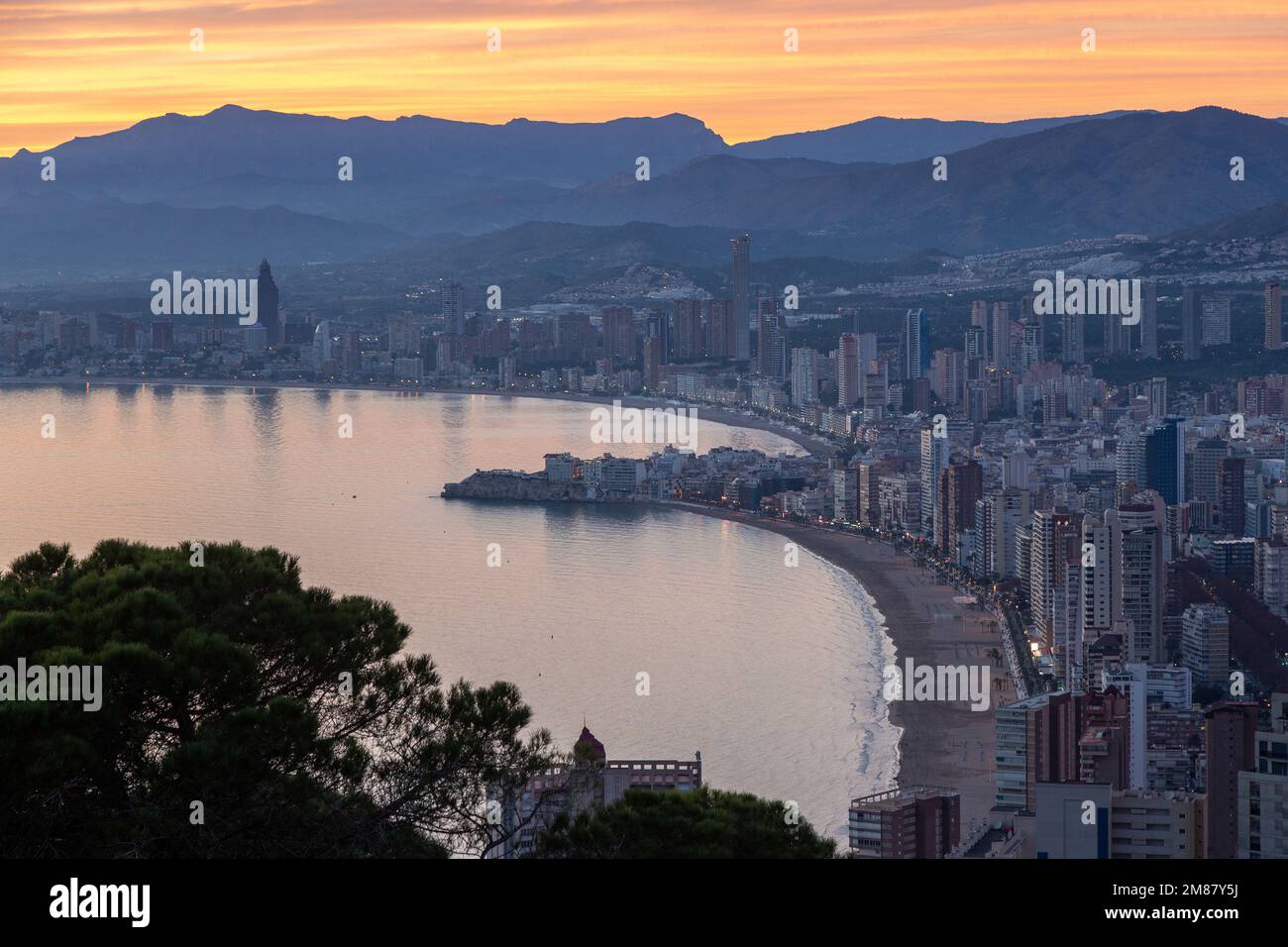 The city of Benidorm at sunset seen from Benidorm Cross Stock Photo - Alamy