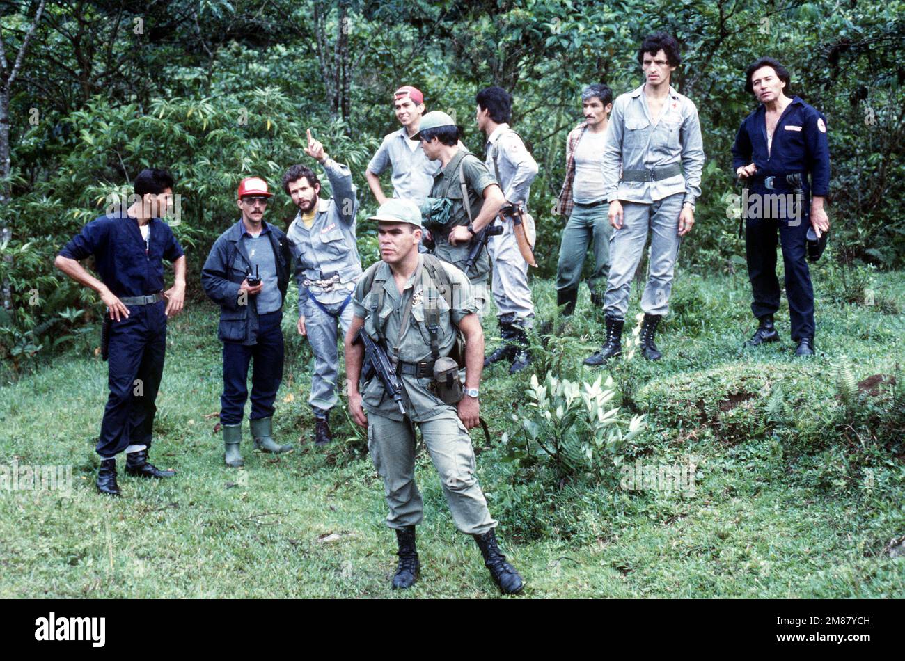 Costa Rican police and Red Cross workers wait for a Detachment 1, 1ST ...