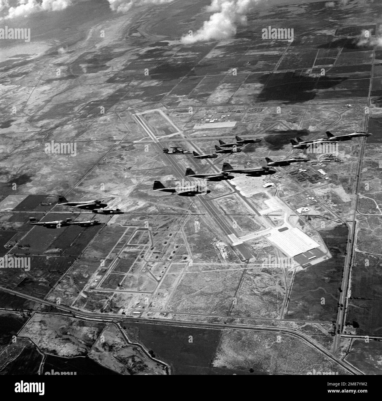 An air-to-air right side view of sixteen aircraft of Carrier Air Wing 7 ...