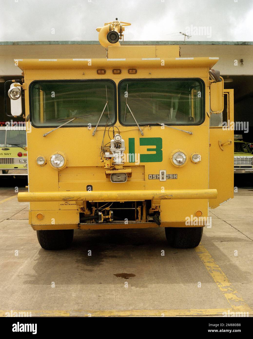 A P-4A aircraft firefighting and rescue truck stands in front of ...