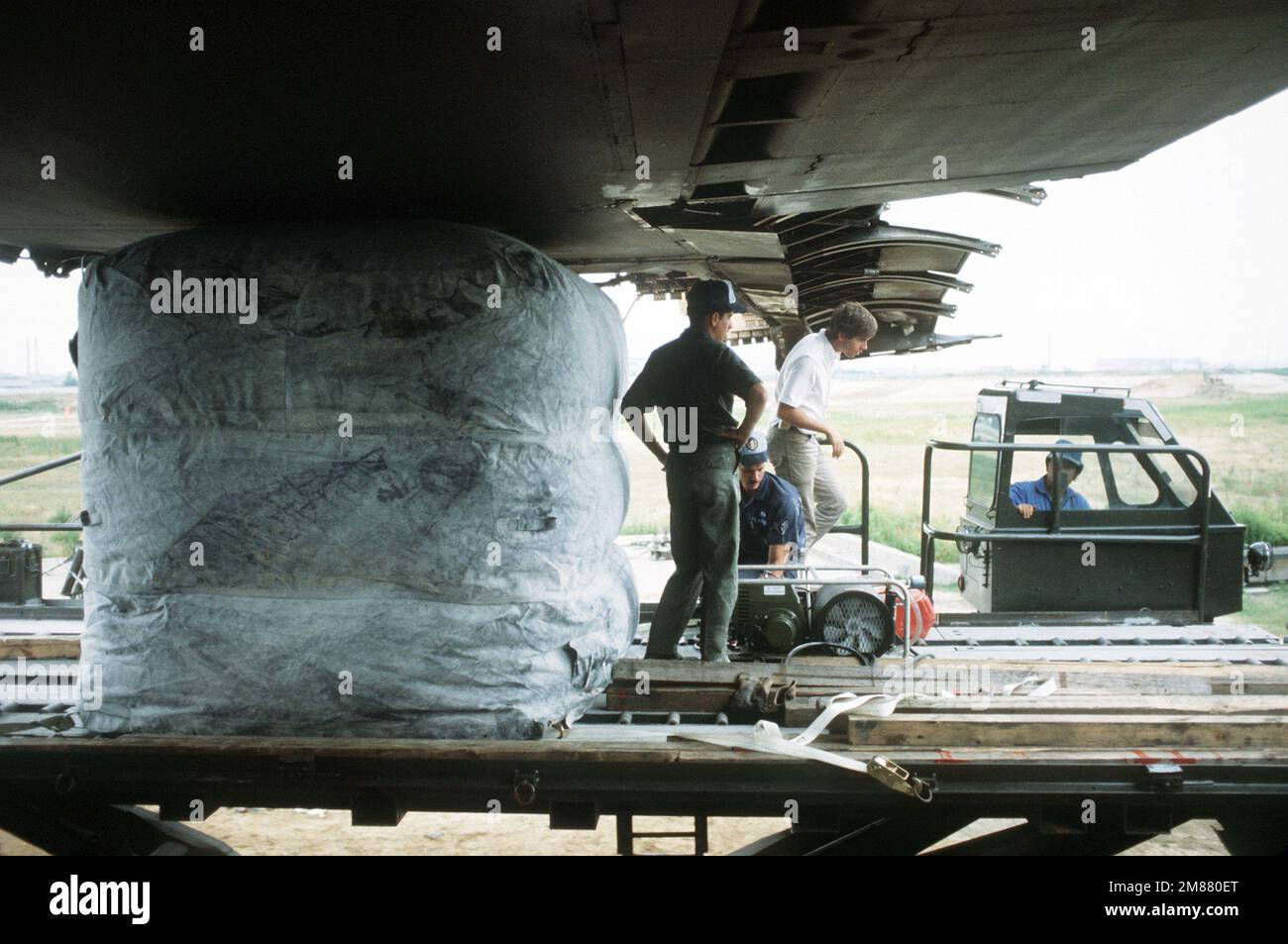 Marine Corps Air Station. Using K-Loaders, airbags are placed under ...