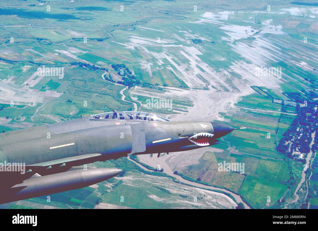 An air-to-air right side view of an F-4 Phantom II aircraft during ...