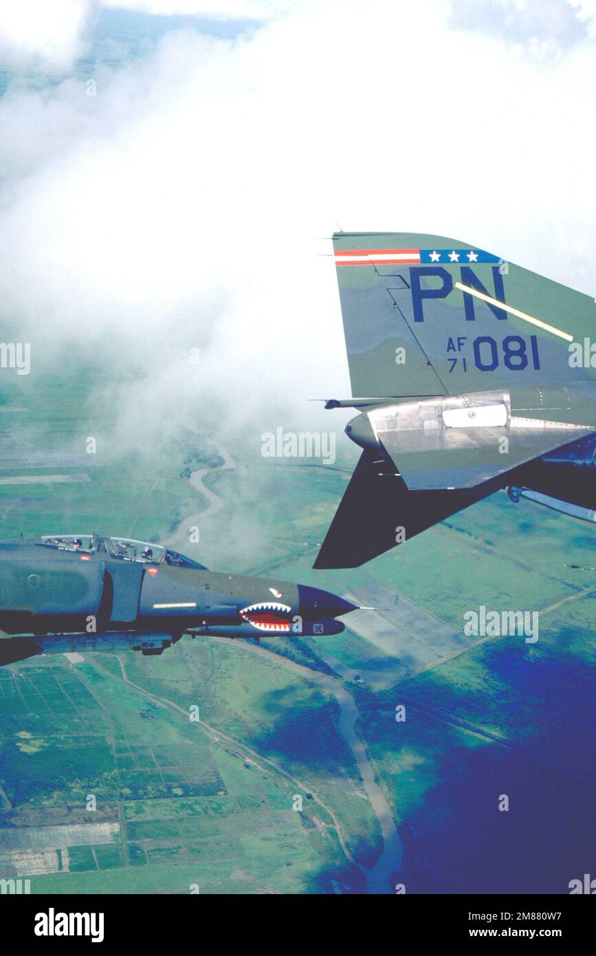 A partial air-to-air view of two F-4 Phantom II aircraft during ...