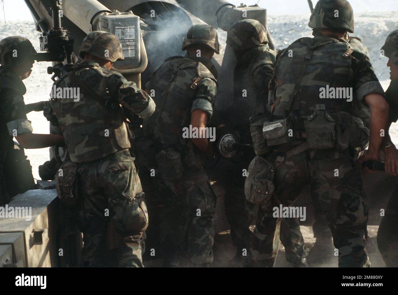 Members of Btry. D, 2nd Bn., 14th Artillery Regt., load an M-198 155mm ...
