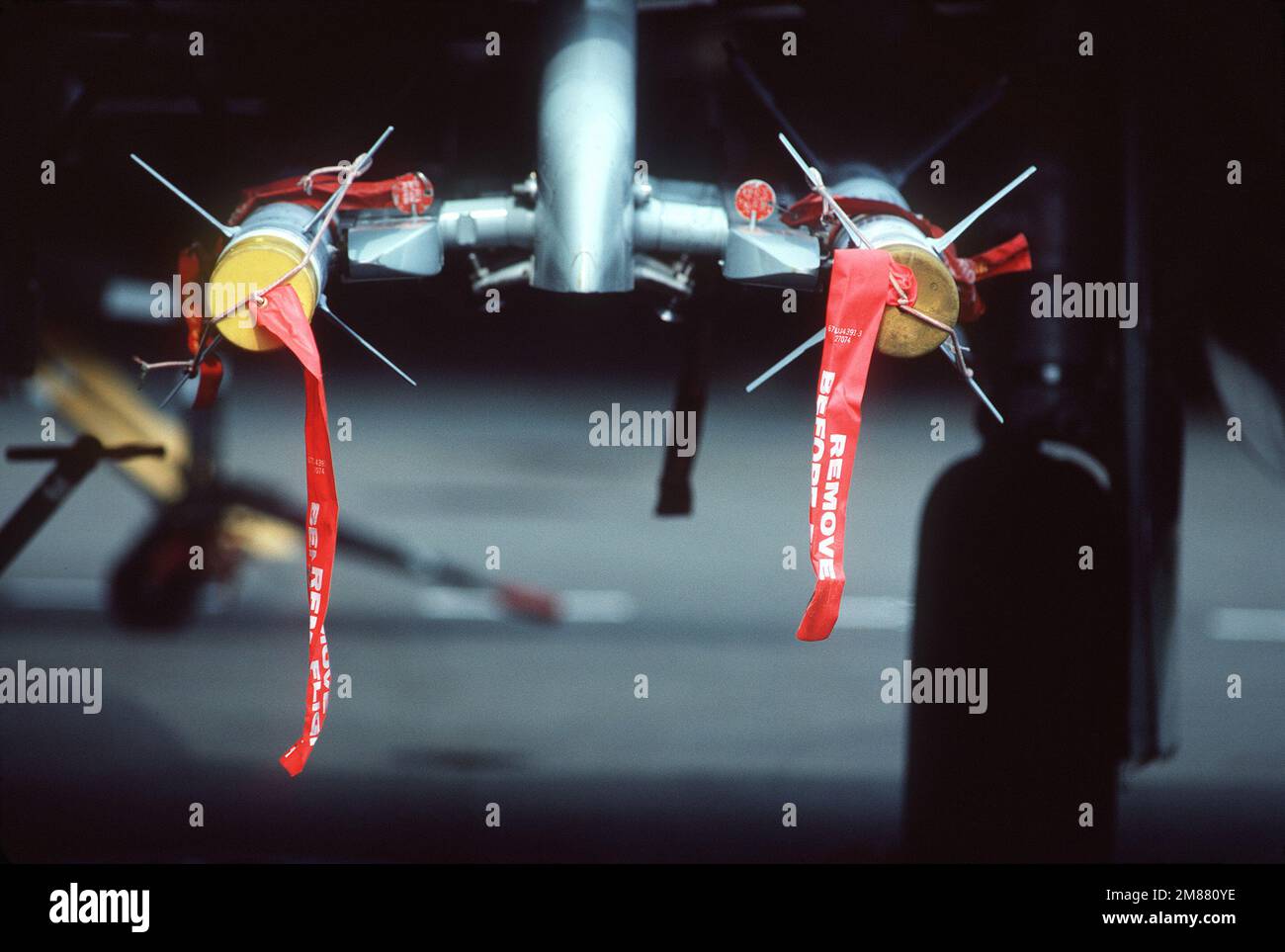 Two AIM-9 Sidewinder missiles are mounted on the wing pylon of an F-4D ...