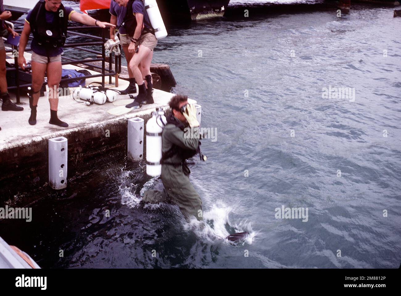A reservist diver from Mobile Diving Salvage Unit 1 makes a dive at the ...