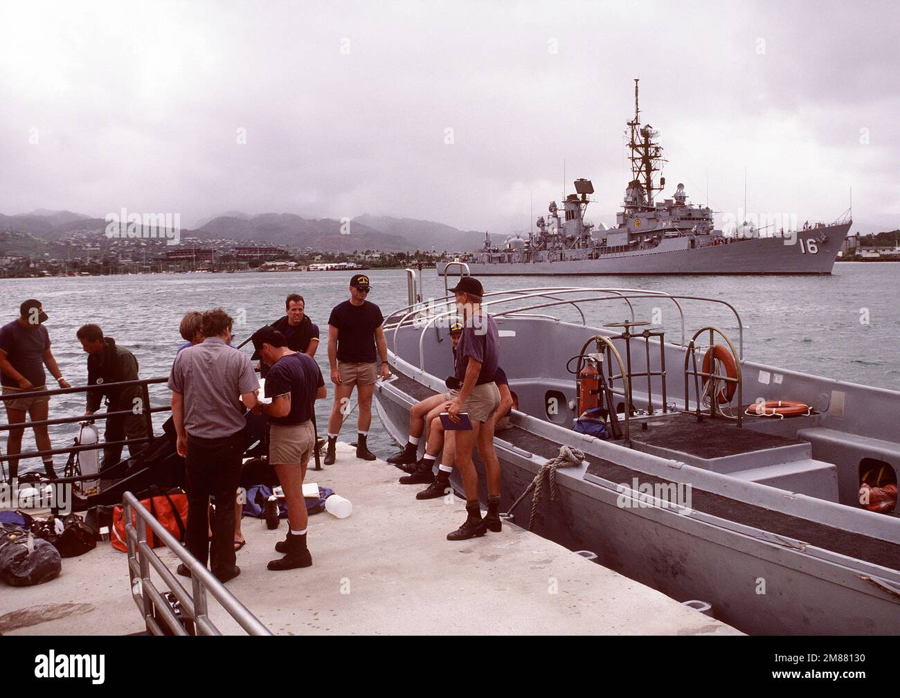Members of Mobile Diving Salvage Unit 1 stand by before making a dive ...