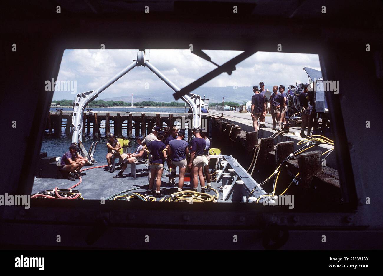 Members of Mobile Diving Salvage Unit 1 prepare to dive at the USS ...