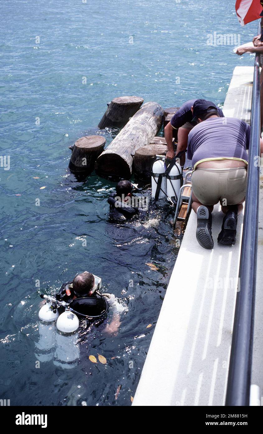 Members of Mobile Diving Salvage Unit 1 prepare to dive at the USS ...