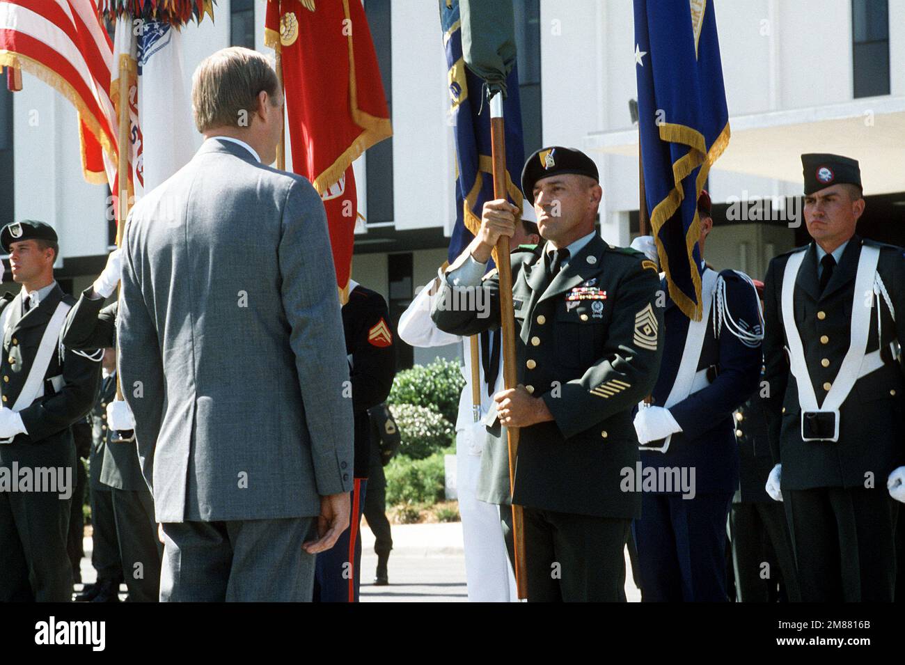 An Army first sergeant presents the command flag to William H. Taft IV ...