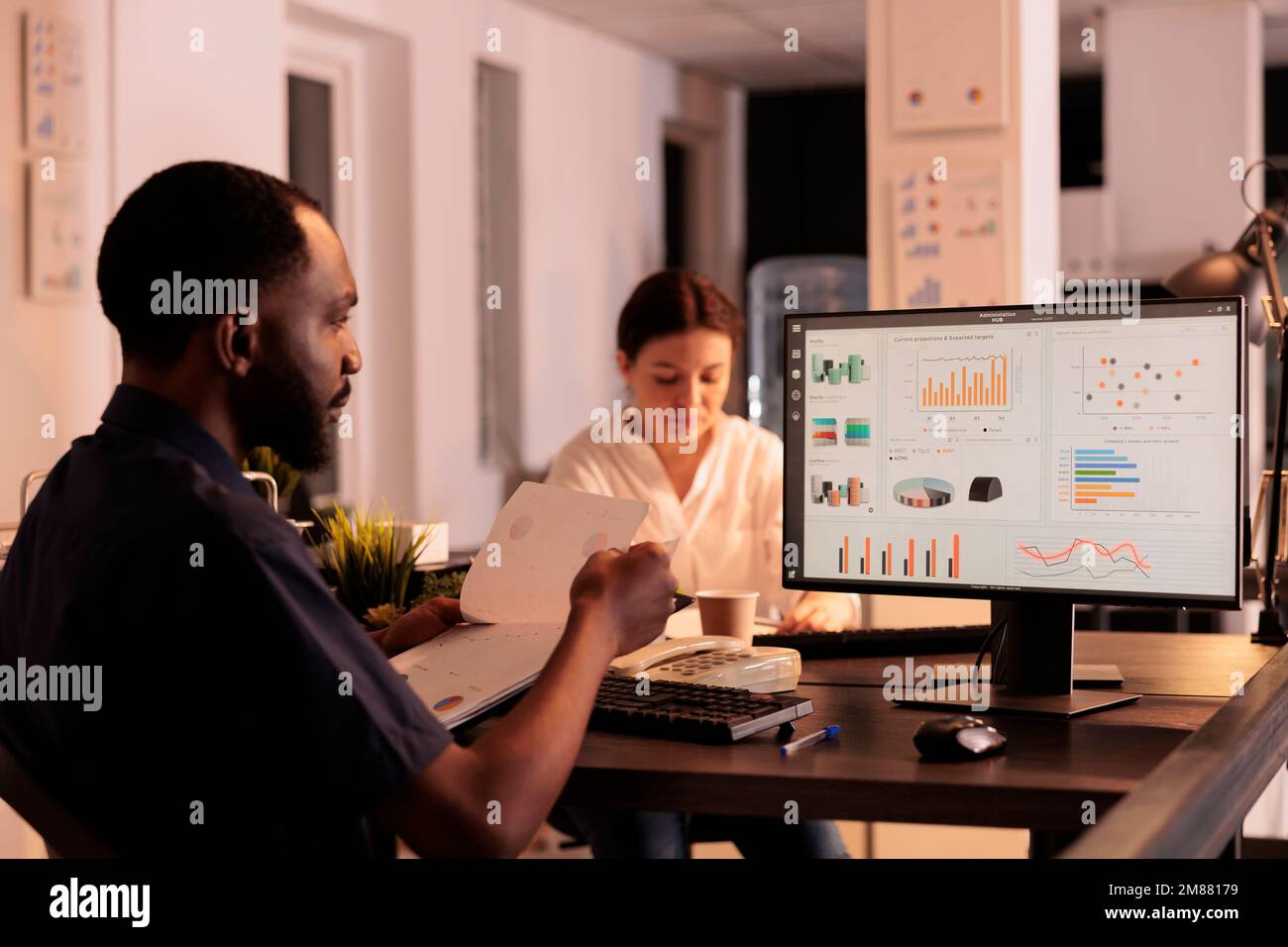 Analyst comparing marketing report on computer and clipboard, employee analyzing company ...