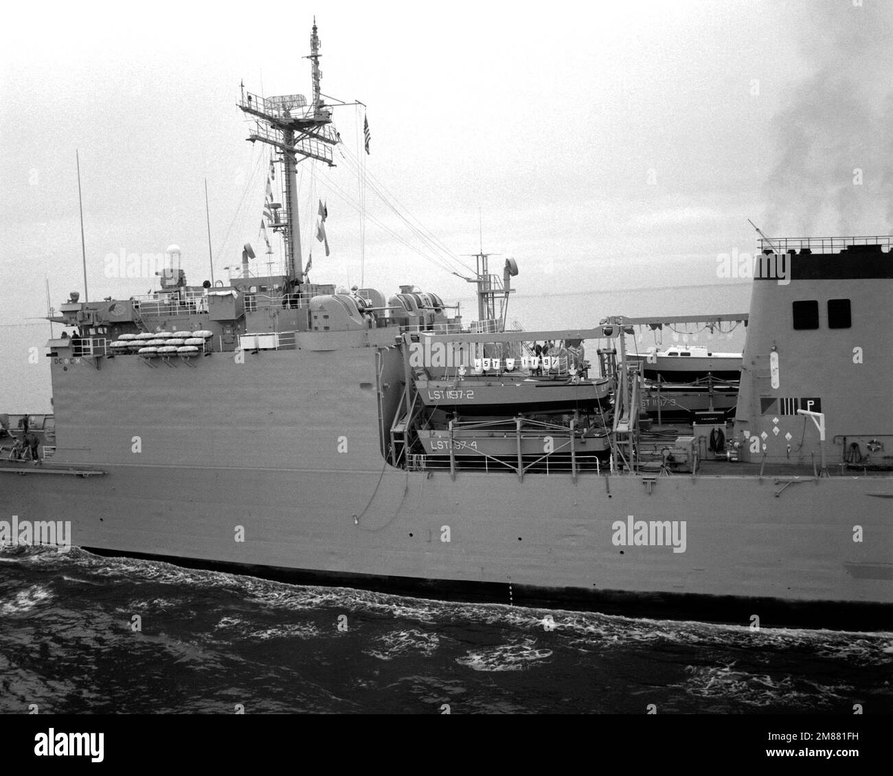A port amidships view of the tank landing ship USS BARNSTABLE COUNTY ...