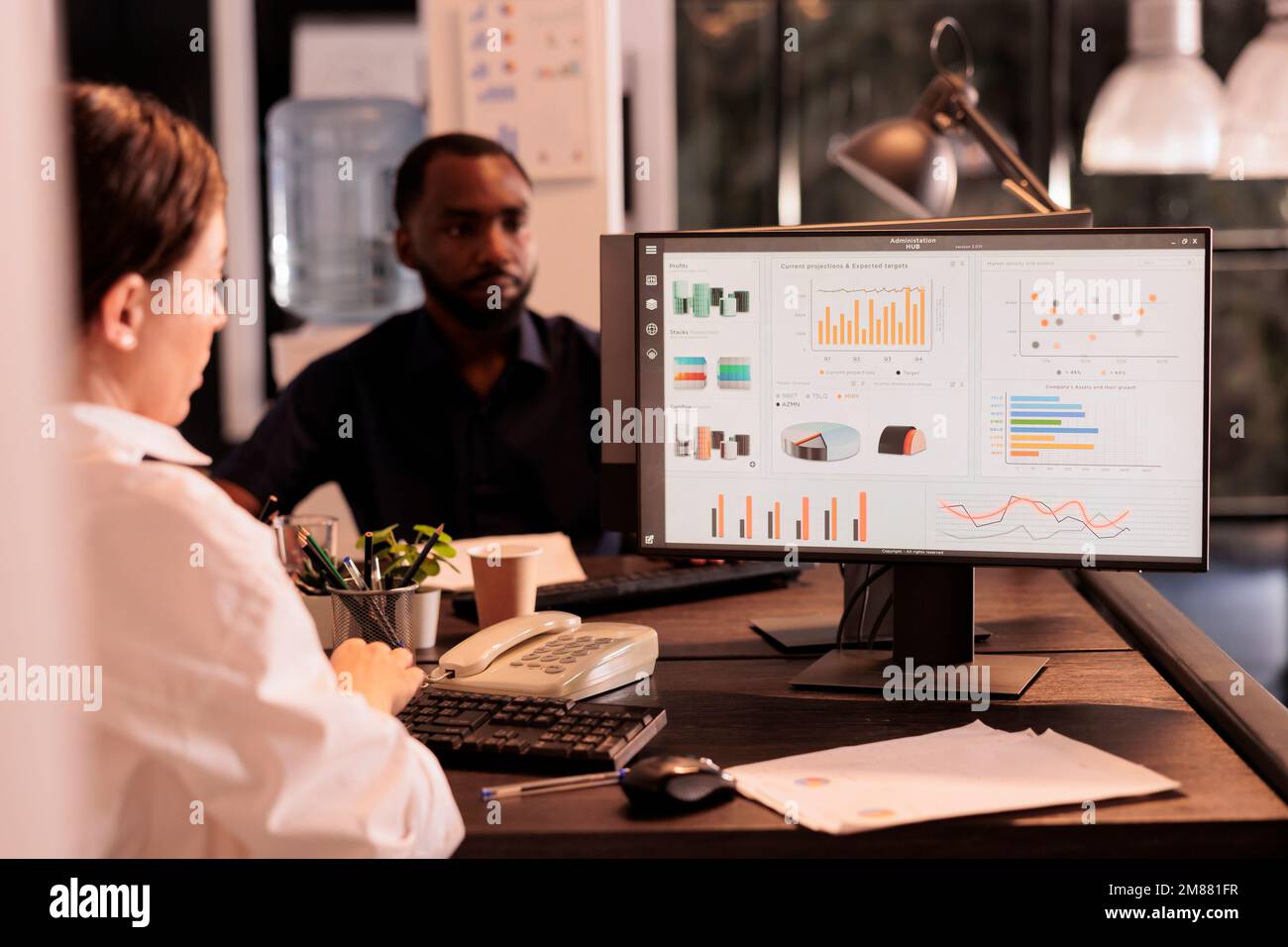 Woman analyzing marketing research statistics in coworking space ...